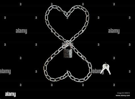Two Chained Hearts Locked With A Padlock With Keys On Black Background