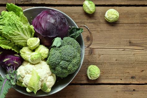Different Varieties Of Cabbages On Wooden Background Organic Fresh