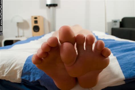 Naked Blonde Girl Displays The Soles Of Her Feet While Ball Gagged And