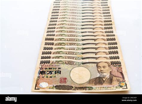 japanese 10 000 yen banknotes overlapping each other in a long line on