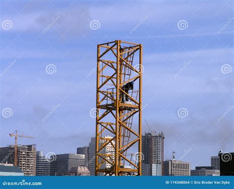 Man Stands Inside Crane Tower As It Is Built Editorial Stock Image Image Of Orange Machinery