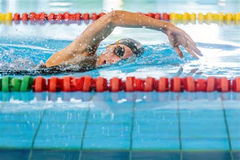 Professional Female Swimmer Swimming The Front Crawl Stroke Stock Image