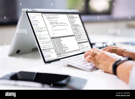 Programmer Or Coder At Office Desk Using Laptop Stock Photo Alamy