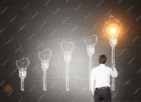 Premium Photo Businessman Firing Torch With Light Bulb