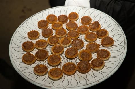 Presentation Of Tarts Filled With Meatloaf Placed On A Large Plate