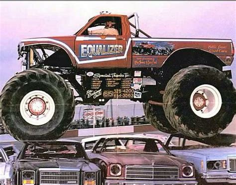 The Monster Truck Is Jumping Over Other Cars