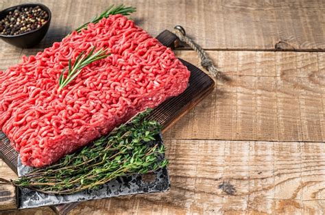 Premium Photo Fresh Raw Mince Beef Meat On A Butcher Cutting Board