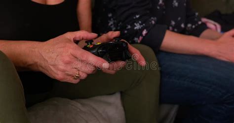 Closeup Of Girls Playing Video Games With Xbox One Controller On The Couch In Ogden Stock Video