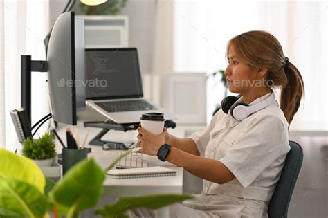 Side View Of Professional Software Developer Working With Coded Data On