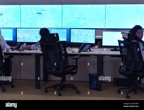 Group Of Female Security Operators Working In A Data System Control