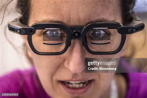 An Attendee Tries Out A Pair Of Ntt Docomo Xr Smart Glasses At The