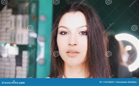 Young Brunette In A Beauty Salon Posing And Looking Into Camera Stock