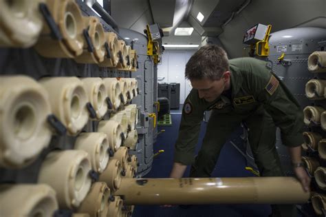 Sailor Loads A Sonobuoy Aboard A P 8 Navair