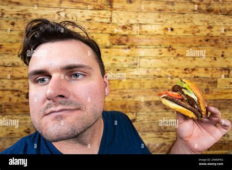 Happy Man With His Fast Food Burger Not So Much Healthy Life Style