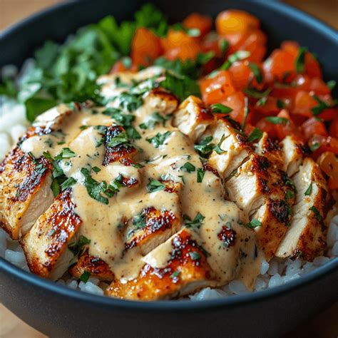 Flavorful Chicken And Rice Bowls With Creamy Garlic Sauce