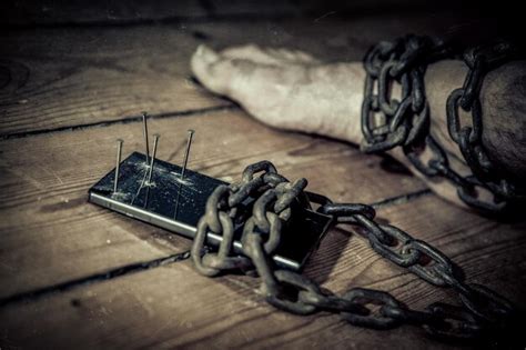 Premium Photo Low Section Of Man Chained To Mobile Phone