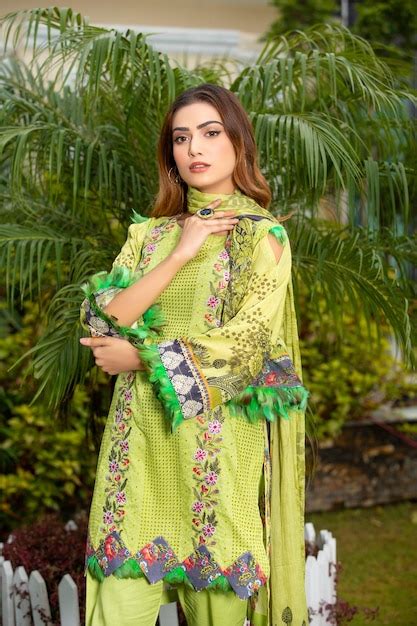 Blonde Hair Girl Wearing Green Desi Dress For Fashion Photoshoot In A