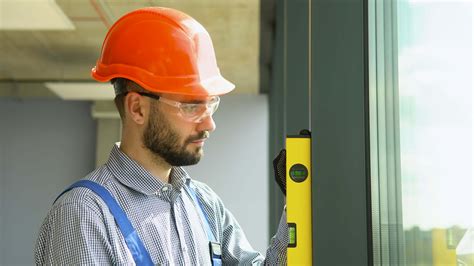 Builder Measures Of The Vertical Deviation Of Pvc Windows A Repairman