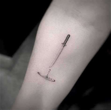Katana Tattoo Located On The Inner Forearm