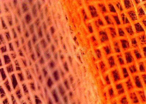 Bright Red Knitting Yarn Pattern Fragment Of Fabric Textile Image Under The Microscope