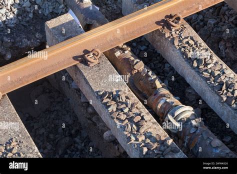 Pipe Damaged By Tamper Packing Ballast Under Sleepers That May Have
