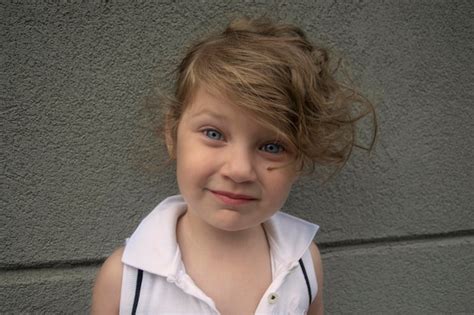 Premium Photo Portrait Of Cute Girl Against Wall