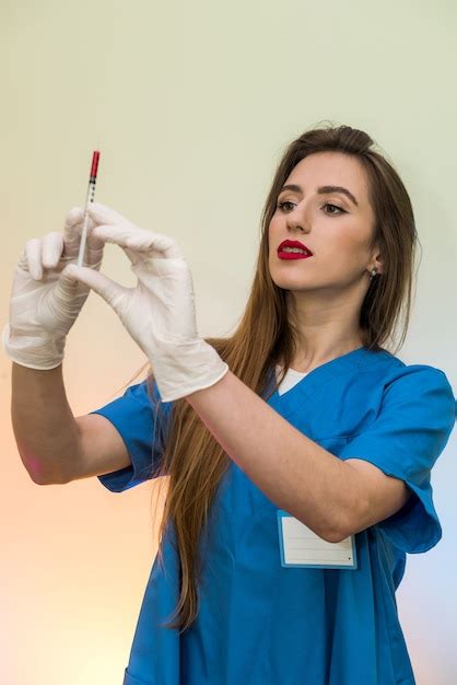 Premium Photo Attractive Nurse With Syringe Getting Ready For