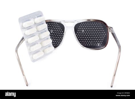Blister Pack Of Tablets With A Pair Of Pinhole Glasses Or Stenopeic