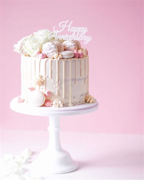 Cute Semi Naked Anniversary Cake With A Belgian White Chocolate Drip Macarons Roses Sprinkles