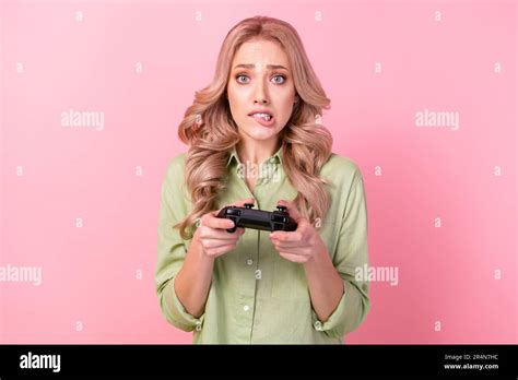 Photo Of Doubtful Unsure Lady Wear Green Shirt Loosing Playstation Game