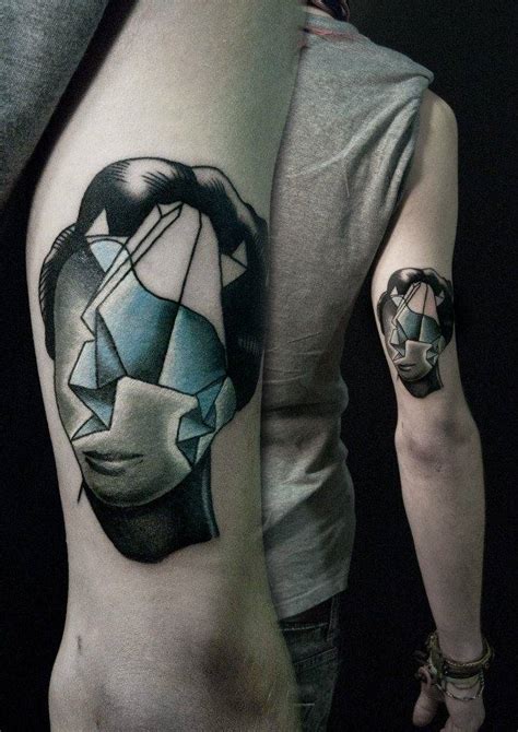 Surrealist Portrait Tattoo On The Back Of The Right
