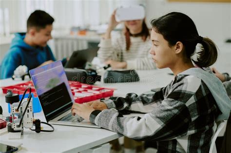 Girl With Pony Tail Coding At Desk Stock Photo Image Of Education