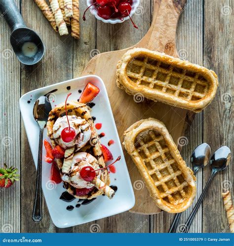 Waffle Boat Ice Cream Sundae Topped With Maraschino Cherries And Chocolate Sauce Stock Image