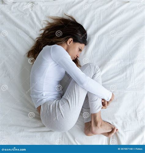 Top View Depressed Woman Lying In Bed Crying And Screaming With