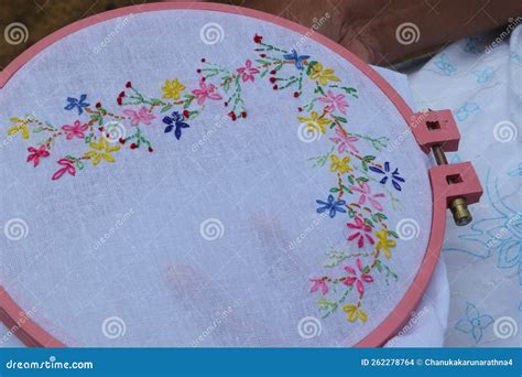 Close Up View Of A Hand Embroidery On A Cloth Crafted Using Lazy Daisy