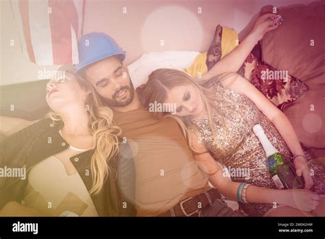 Sleeping Drunk And Party With Friends On Sofa With Hangover From
