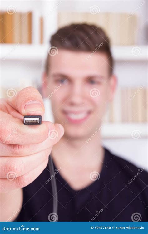 Smiling Man Holding And Showing USB Cable Stock Photo Image Of Holding File