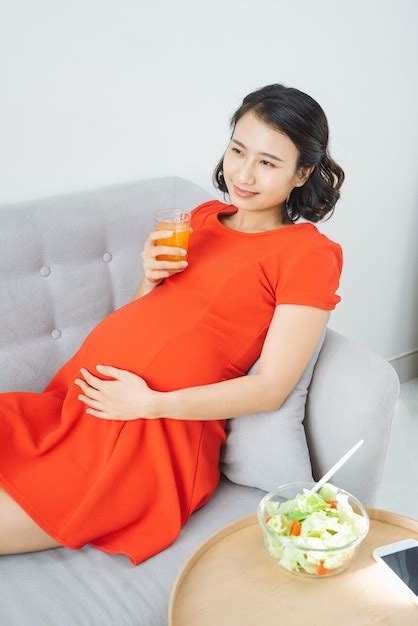 Premium Photo Pretty Young Asian Pregnant Woman Eating Salad And