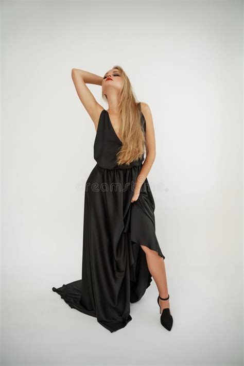 Woman In Black Dress On White Background In The Studio Elegant Lady In