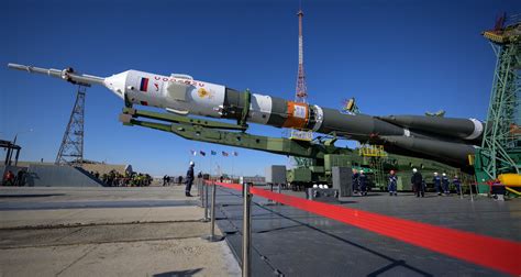 Soyuz Rocket Rolls Out For Launch Of Russian American Crew To Space