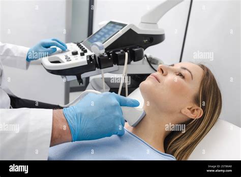 Woman Patient Receives Thyroid Diagnostics Treatment Of Thyrotoxicosis And Hypothyroidism