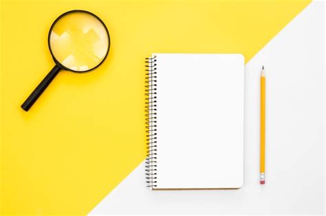 Free Photo Blank Notepad On Colored Background Flat Lay