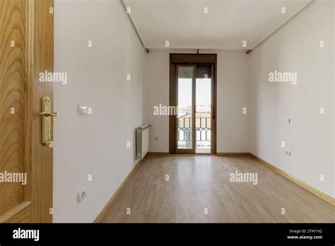 Empty Room In A House With White Painted Walls Wooden Floors White