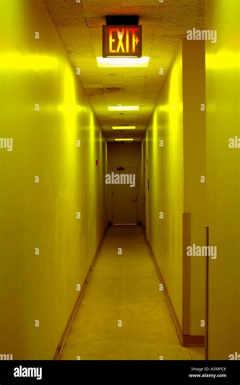 An Illuminated Exit Sign In A Building Corridor Stock Photo Alamy