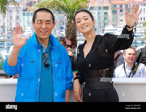 Chinese Director Zhang Yimou Left And Chinese Actress Gong Li Wave At