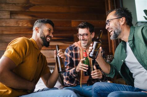Best Friends Togehter Drinking Beer And Talking Concept Of Male