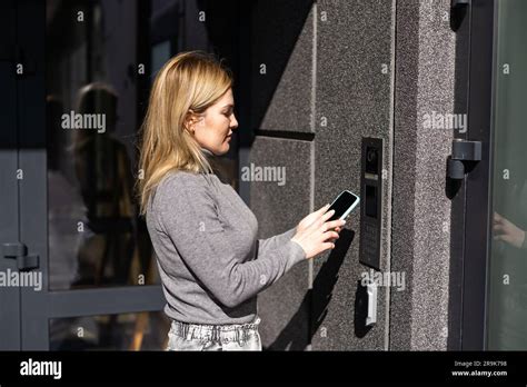 Female Entering Secret Key Code For Getting Access And Passing Building Using Application On
