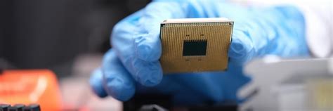 Premium Photo Technician Puts Processor On Computer Motherboard Socket