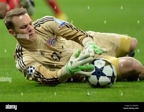 Munichs Goalkeeper Manuel Neuer Saves The Ball During The Uefa Stock