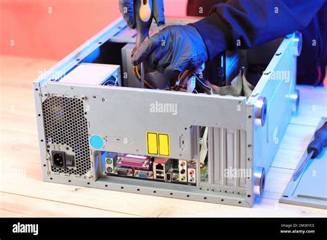 Disassembly Of An Old Desktop Computer On A Table And A Pink Background